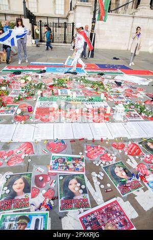 Posters and messages in support of freedom and monarchism for Iran are ...