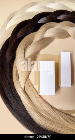 A strand of natural light hair for extensions with a box of care ...