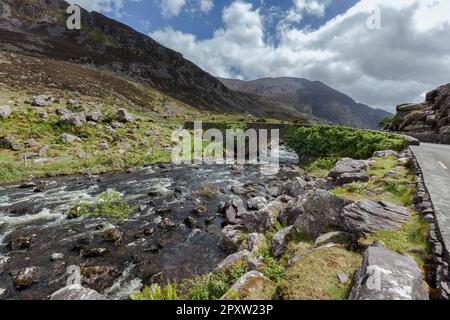 Wishing bridge over River Loe in Gap of Dunloe mountain pass through ...