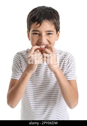 Boy biting his nails Stock Photo - Alamy