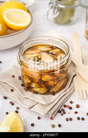 Jar with pickled mussels on white background Stock Photo - Alamy