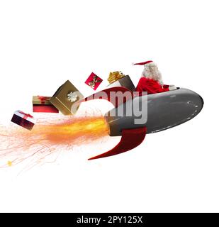 Santa claus delivers gifts with a fast rocket Stock Photo - Alamy