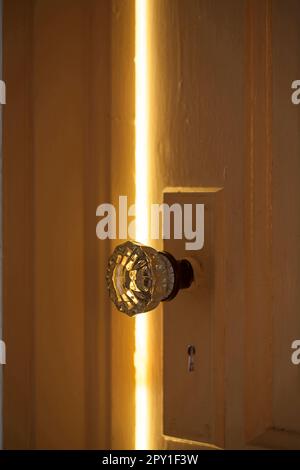 Closed door with light coming through Stock Photo - Alamy