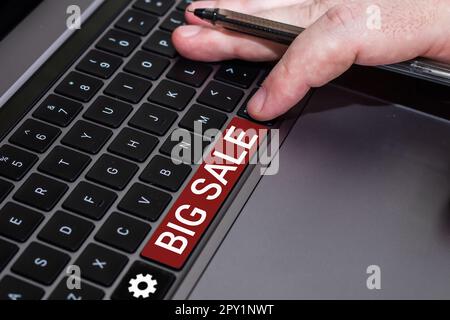 Hand writing sign Big Sale. Word Written on putting products on high ...