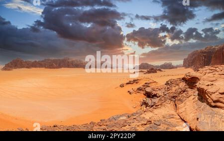 Red sands, mountains, dramatic sky and marthian landscape panorama of ...