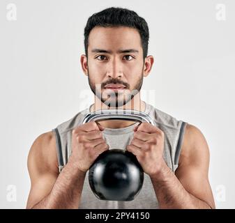 Handsome Athletic Men Exercising With Kettlebell in the gym Stock Photo ...