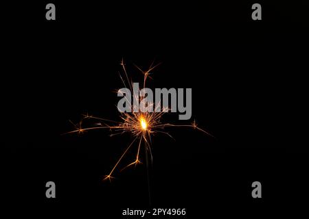 One burning sparkler stick on black background Stock Photo - Alamy