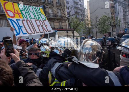 A protester holds a placard that says "Paris Antifa" during the ...