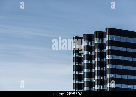 Wavy formed glass facade of a newly constructed office skyrise Stock ...