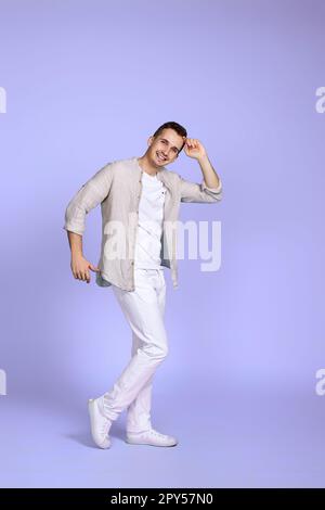 happy man dancing on pastel violet background Stock Photo - Alamy