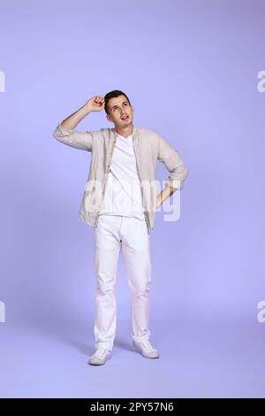 positive dreamy thoughtful young handsome man thinking Stock Photo - Alamy