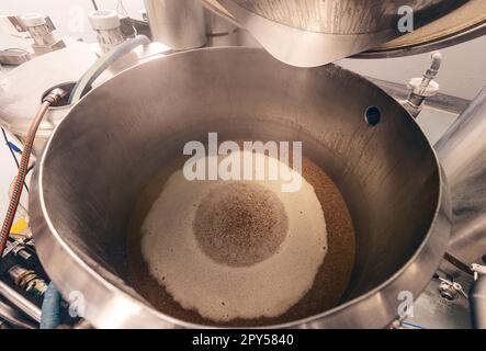 Opened brewing vat. Fermentation of beer wort inside Stock Photo - Alamy
