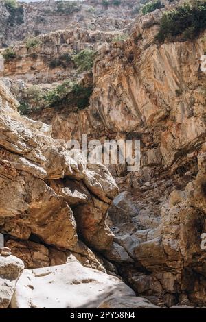 Steep hill as seen from the bottom of canyon Stock Photo - Alamy
