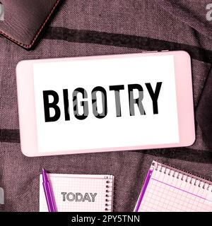 Hand writing sign Bigotry. Business concept obstinate or intolerant ...