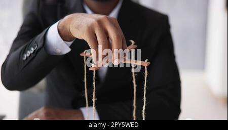 Marionette Manipulation With Hand Holding Puppet Strings Stock Photo ...