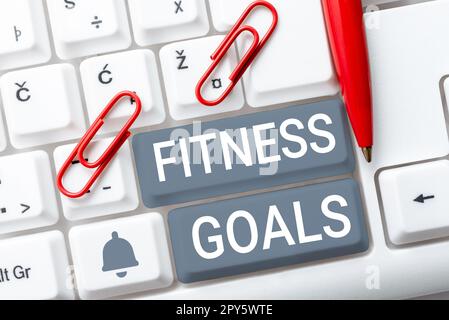 Hand writing sign Fitness Goals. Internet Concept Loose fat Build ...