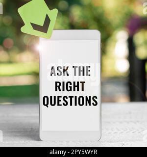 Hand writing sign Ask The Right Questions. Concept meaning Look for a ...