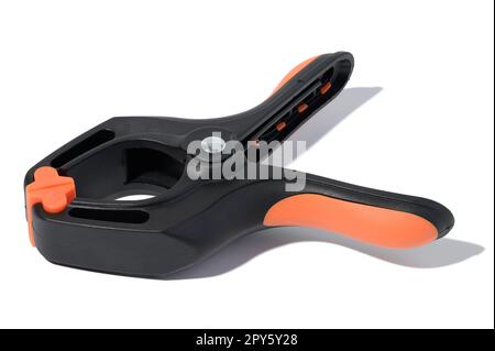 Large plastic clamp on a white isolated background Stock Photo - Alamy