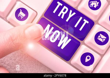 Hand writing sign Try It Now. Business approach Free trial of something ...