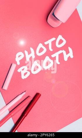 Hand writing sign Photo Booth. Concept meaning form of photo sharing ...