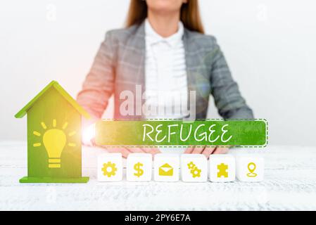 Hand writing sign Refugee. Business concept refer to movements of large ...