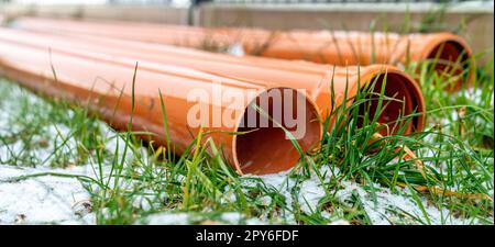 red plastic pipe for waste water in the construction site Stock Photo ...