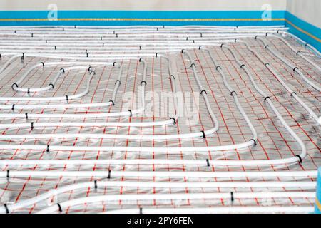 white heating radiator under in the room Stock Photo - Alamy