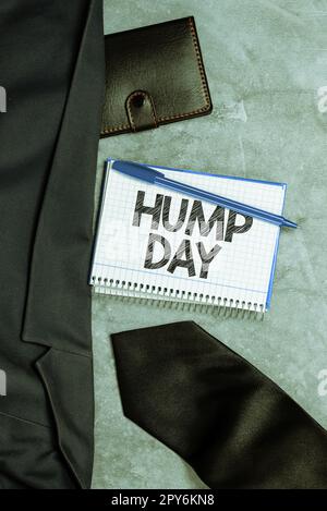 Text caption presenting Hump Day. Concept meaning climbing a proverbial ...