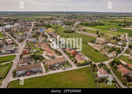 Captivating aerial perspective of a quaint village nestled amidst the ...