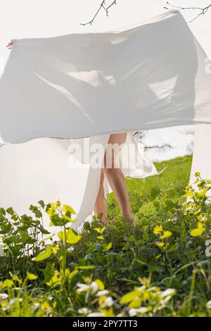 Lady posing with white cloth scenic photography Stock Photo - Alamy