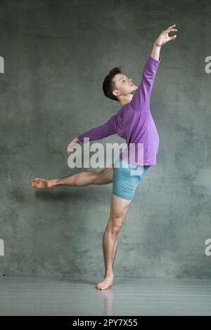 Male dancer in dyanmic dance pose in photo studio Stock Photo - Alamy