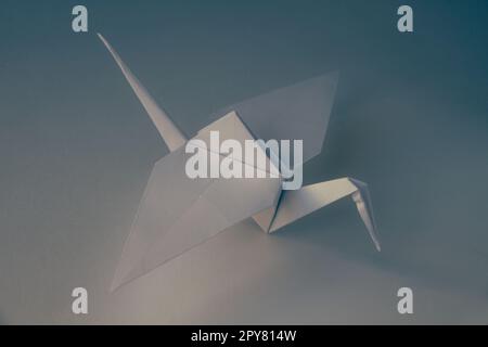 White paper crane origami isolated on a blank background Stock Photo ...