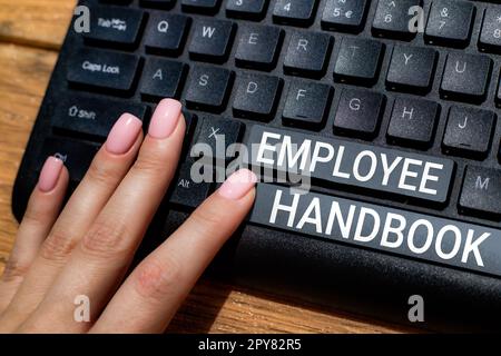 Hand writing sign Employee Handbook. Business idea Document that ...