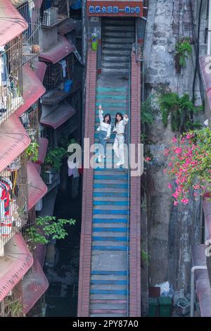 CHONGQING, CHINA - MAY 1, 2023 - A narrow and steep rainbow staircase ...