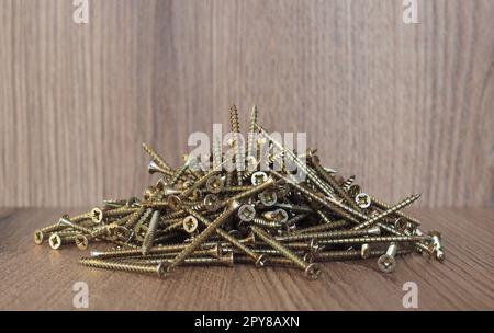 Wood screws on manufactured wood panel Stock Photo - Alamy