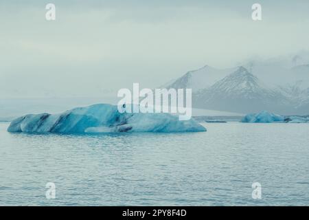 Striped iceberg floating in sea landscape photo Stock Photo - Alamy