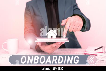 Hand writing sign Onboarding. Word for Action Process of integrating a new employee into an ...