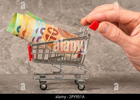 Business person hand pushing currency symbol on multimedia touch screen ...