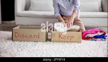 Closet Declutter And Cleaning. Organized Woman Discarding Clothes Stock ...