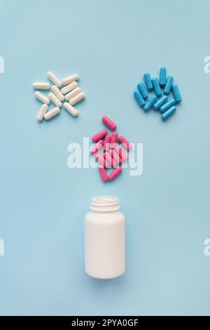 Multicolored pills on a white background Stock Photo - Alamy