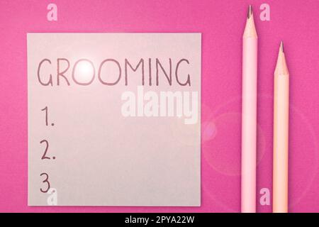 Hand writing sign Grooming. Word for hygienic care and enhancing the ...