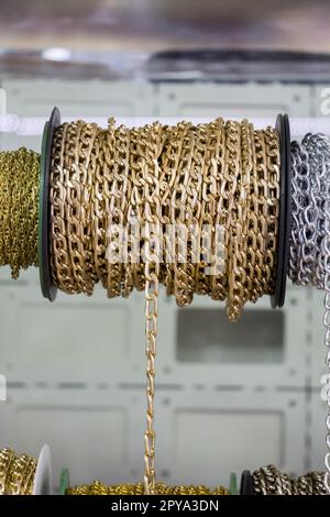 Rolls of decorative chains in view Stock Photo - Alamy