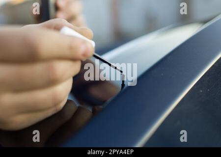 Brush painting small chip scratches car vehicle detailing paint Stock ...