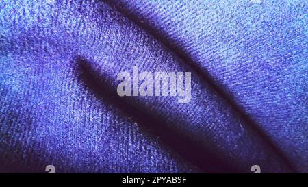 Dark blue fabric that looks like velvet or velveteen. Broken waves ...