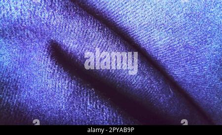 Dark blue fabric that looks like velvet or velveteen. Broken waves ...