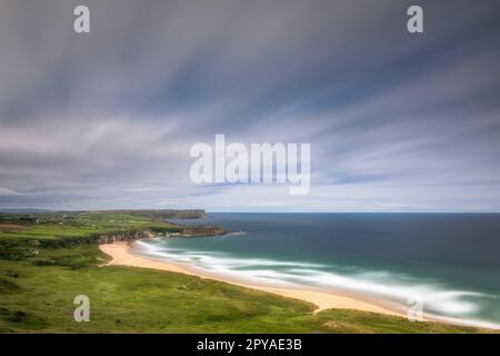 Whitepark Bay Beach and Portbradden Harbour with cliffs, sandy beach ...
