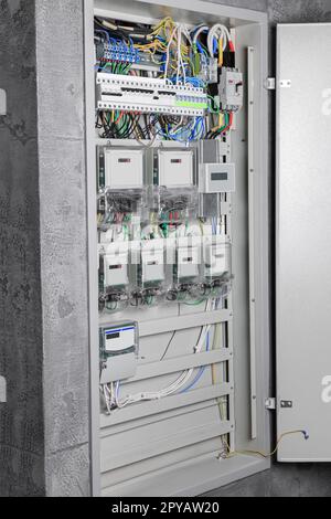 Panel with electric meters and many wires in fuse box Stock Photo - Alamy
