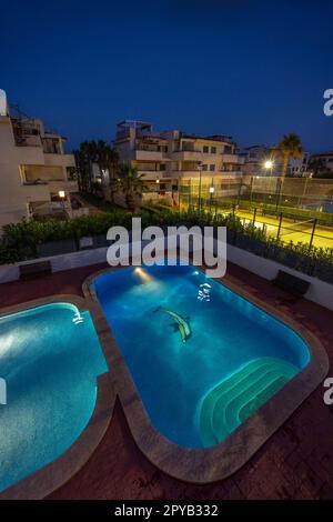illuminated swimming pools at night Stock Photo - Alamy