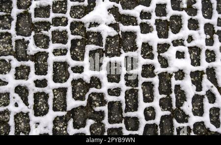 Snowy cobblestone floor Stock Photo - Alamy