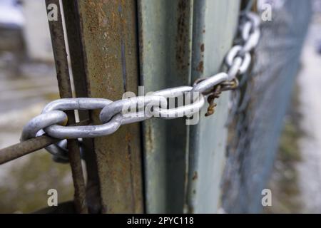 Chain and padlock closing a door Stock Photo - Alamy